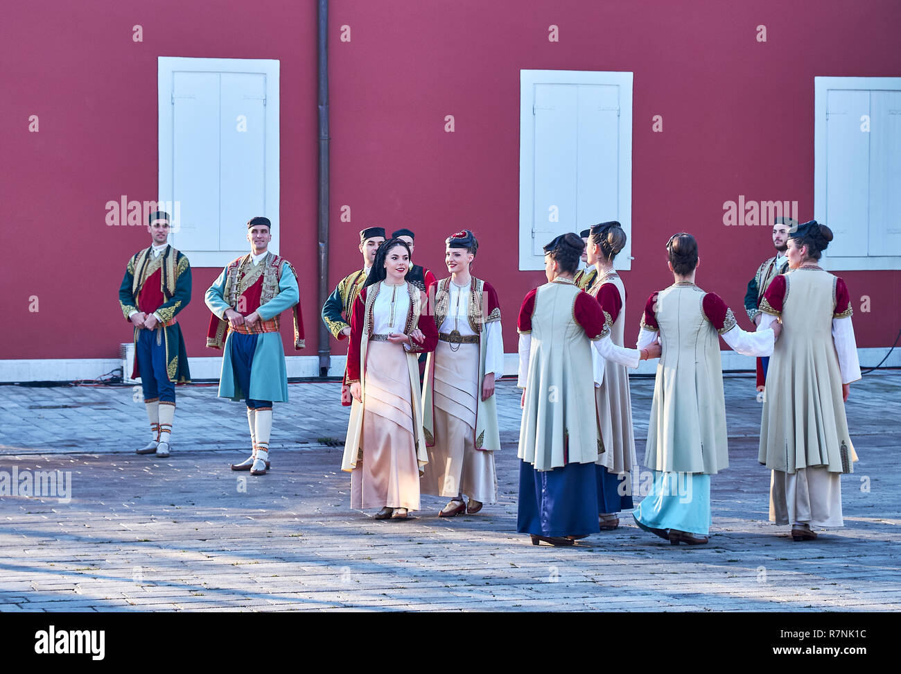 Traditional public dance performance in the square of the former royal ...
