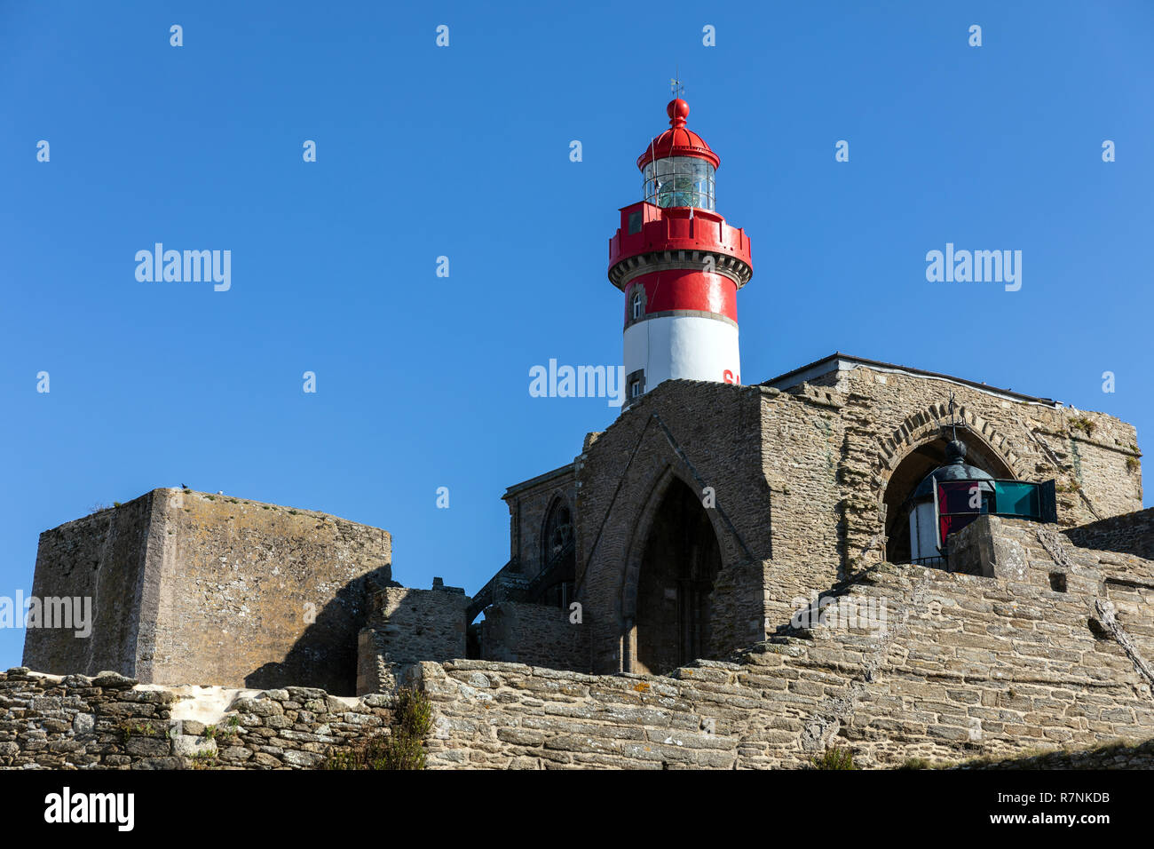 The Saint-Mathieu lighthouse behind the ruins of the abbey Saint ...