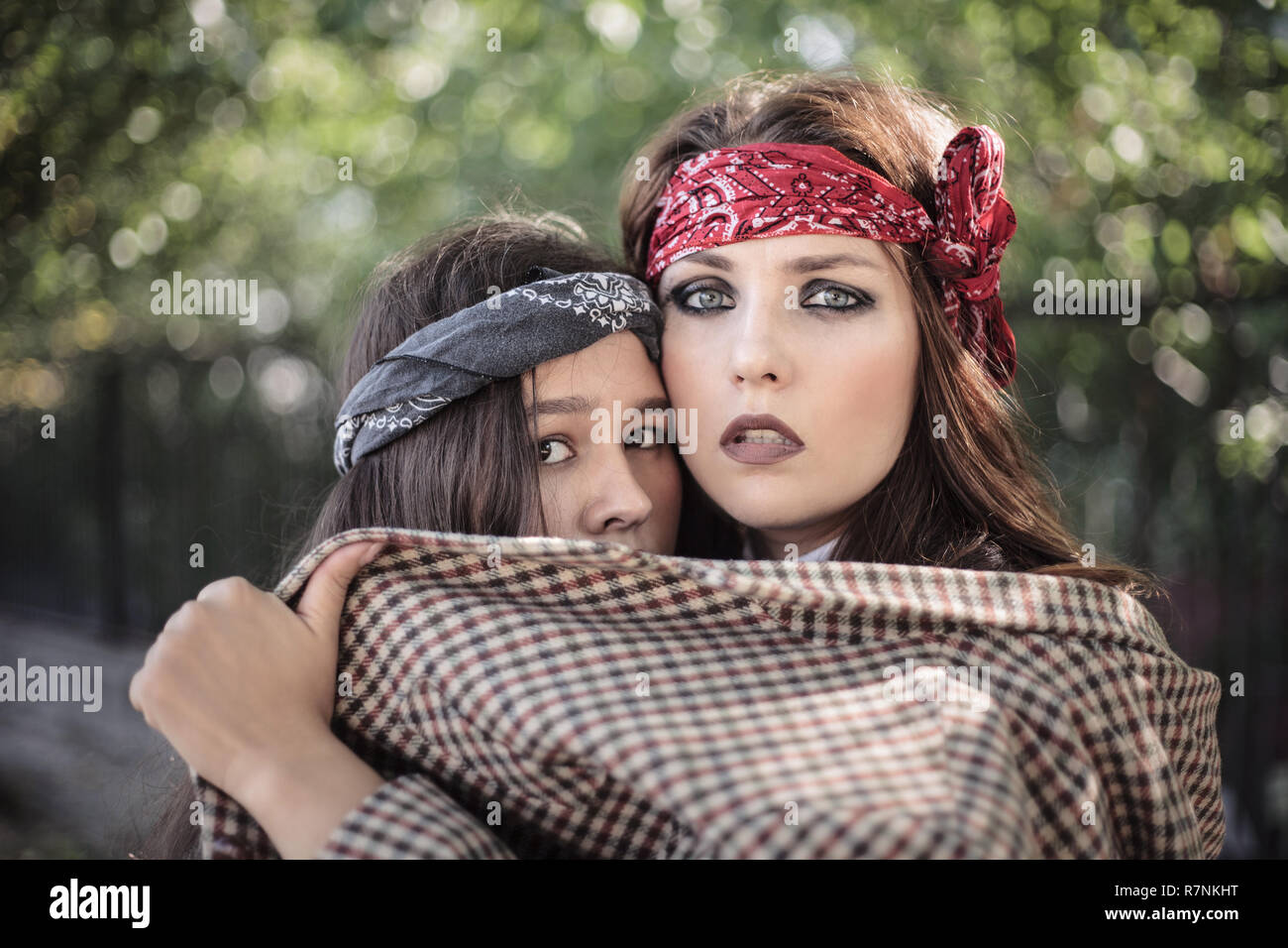 Portrait of two girls outdoors. The concept of difficult teenagers ...