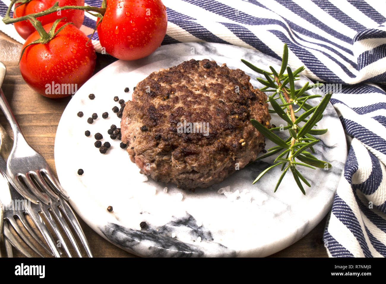 grilled northern ireland beef burger patty with reduced fat on marble ...