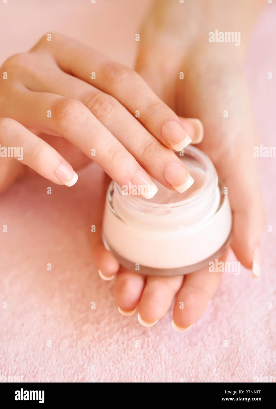 Beautiful woman hands with cream Stock Photo - Alamy