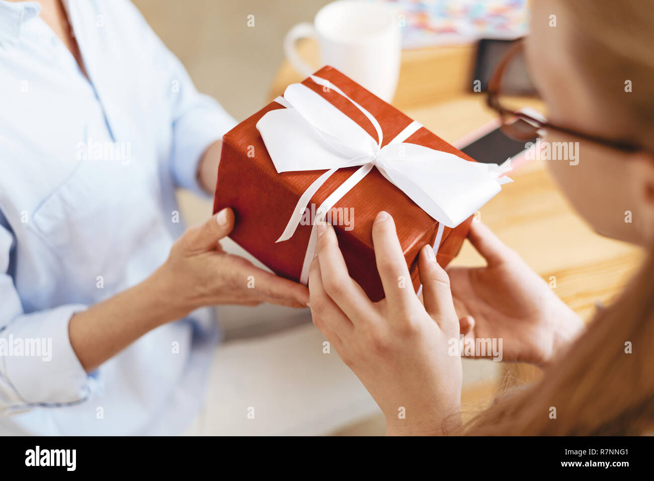 Close up of mother and daughter exchanging gifts Stock Photo - Alamy