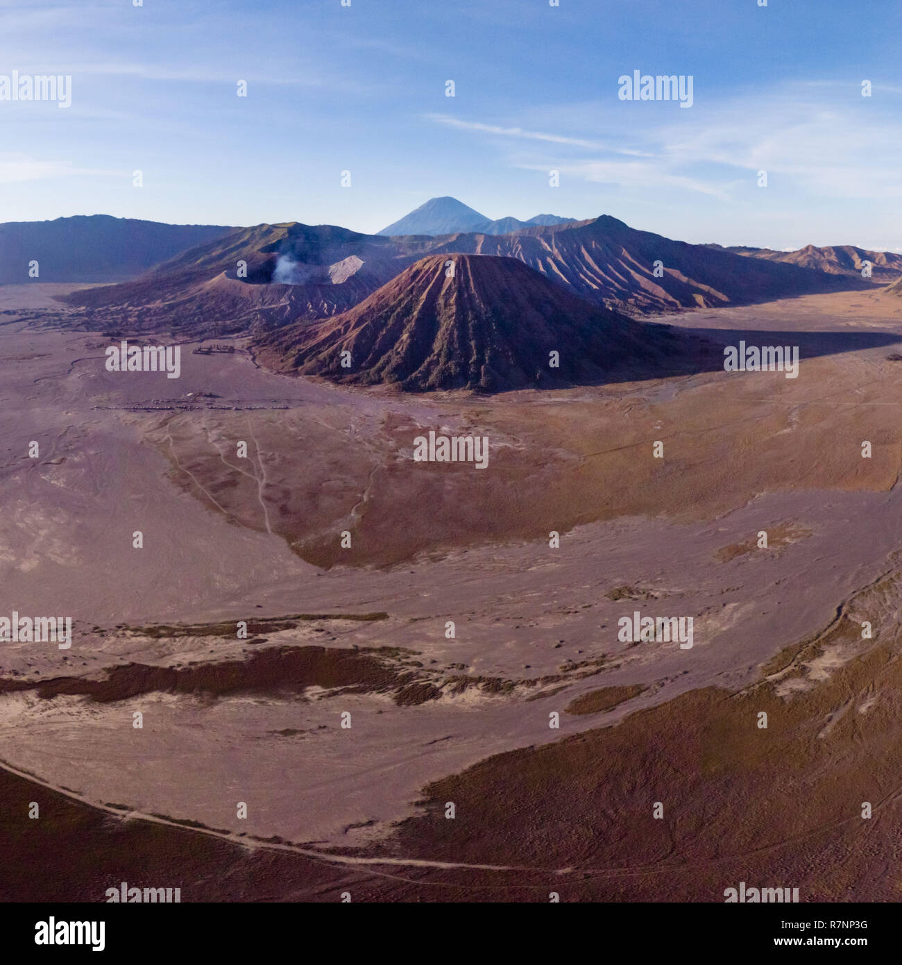 Mount Bromo volcano crater erupts in the caldera, behind Gunung Batok ...