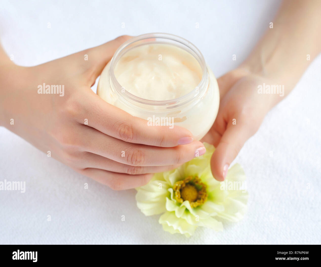 Beautiful woman hands with cream Stock Photo - Alamy