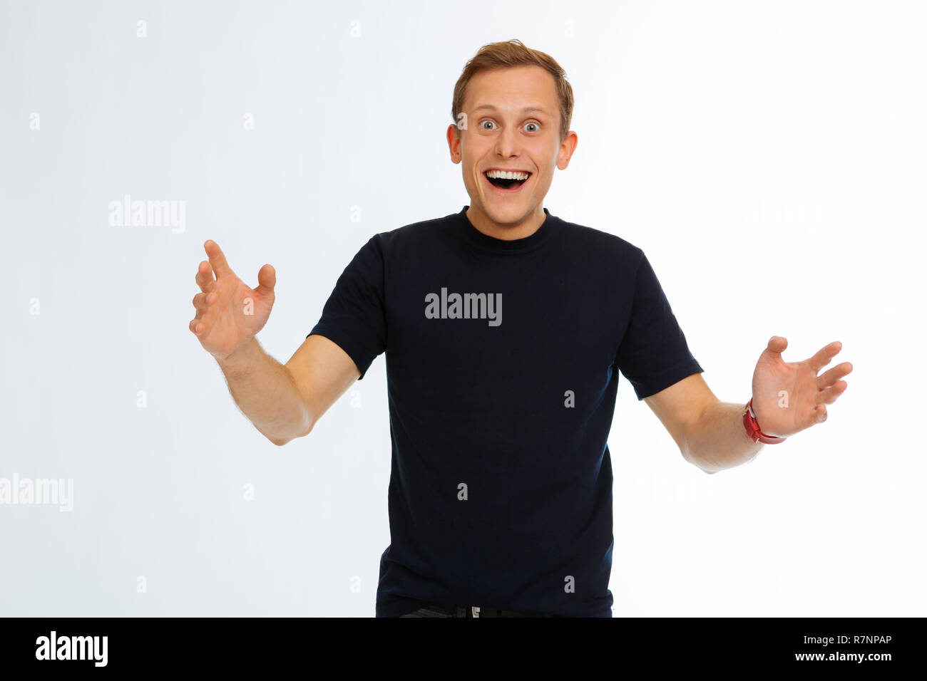 Delighted happy young man feeling very optimistic Stock Photo - Alamy