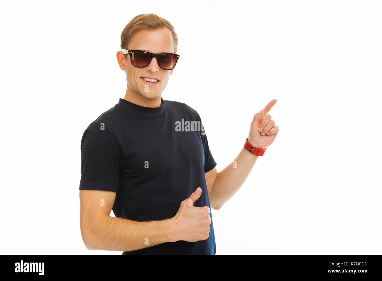 Handsome nice man pointing with his finger Stock Photo - Alamy