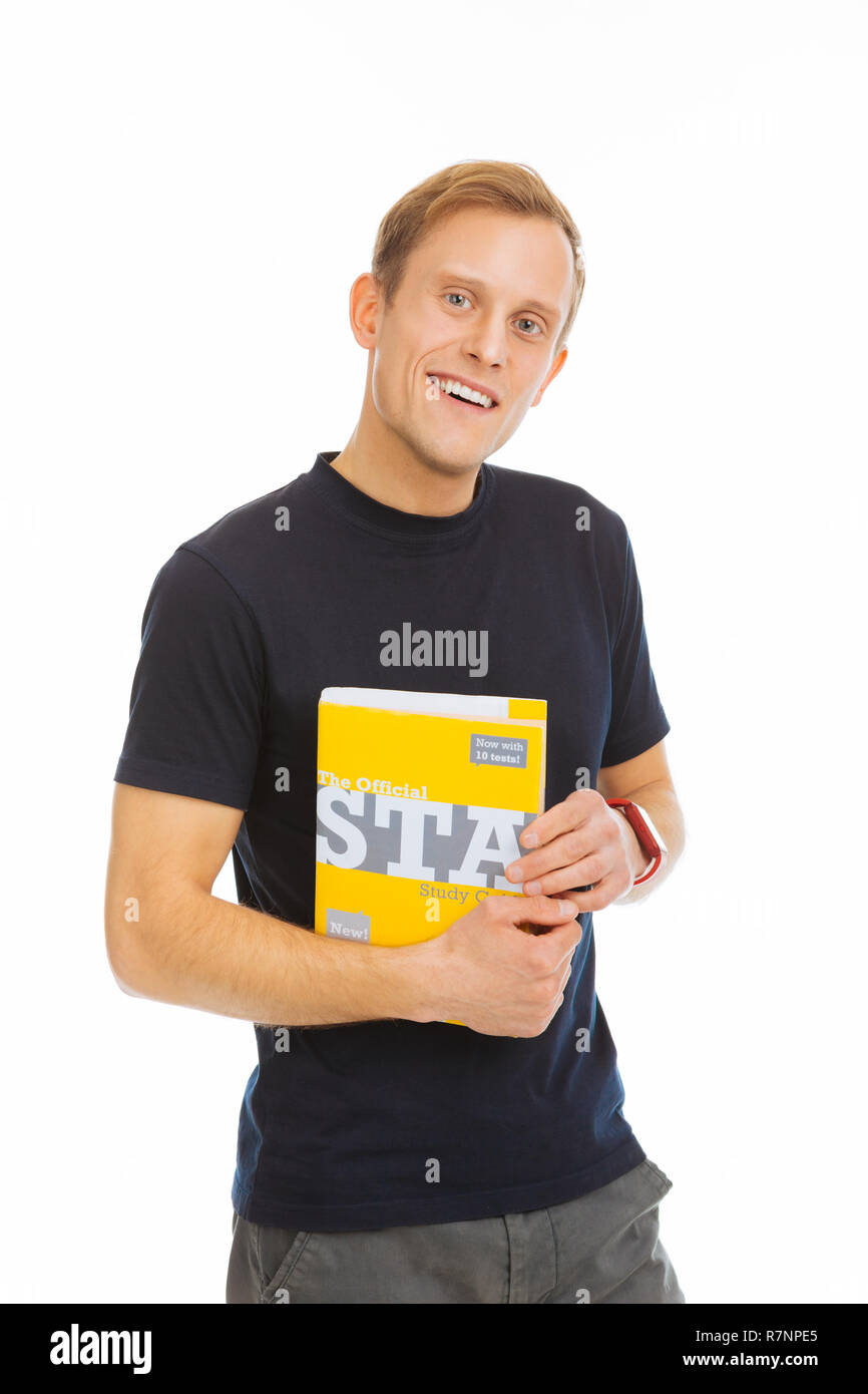 Cheerful positive male student smiling to you Stock Photo - Alamy