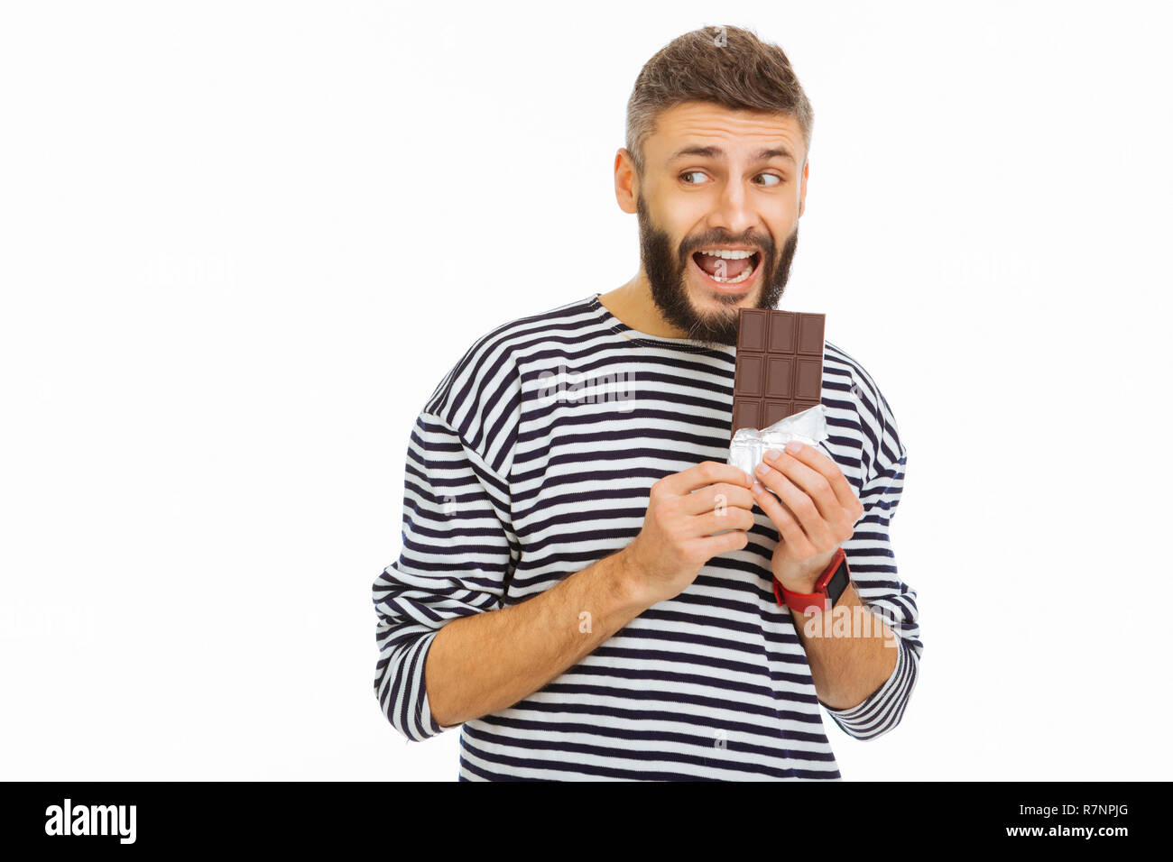 Man eating chocolate bar and happy hi-res stock photography and images ...