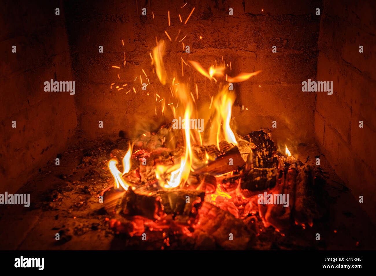 Fire flames in fireplace background Stock Photo - Alamy
