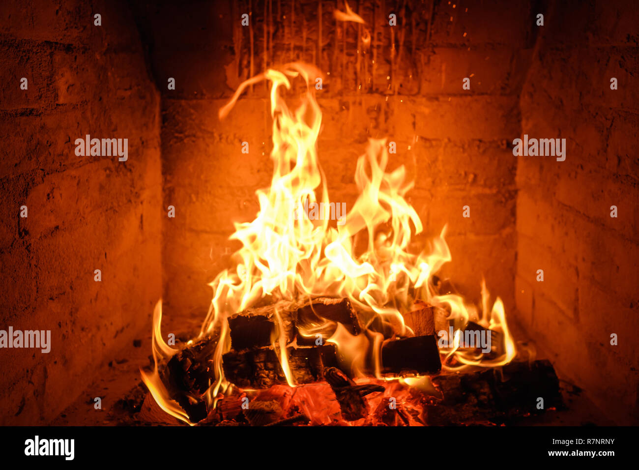 Fire flames in fireplace background Stock Photo - Alamy