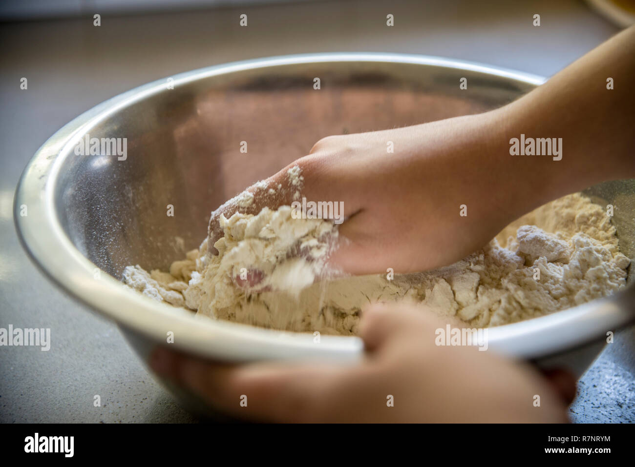 Hand kneading dough Stock Photo - Alamy