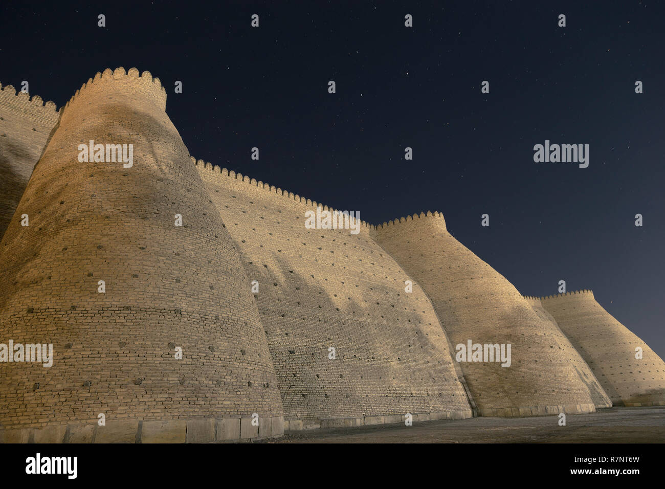 City walls of the ancient city of Bukhara in Uzbekistan, at the starry ...