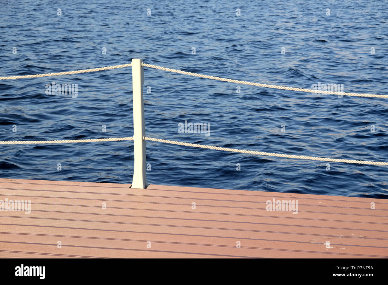 Landscape with part of the quay and the fencing with ropes from the ...