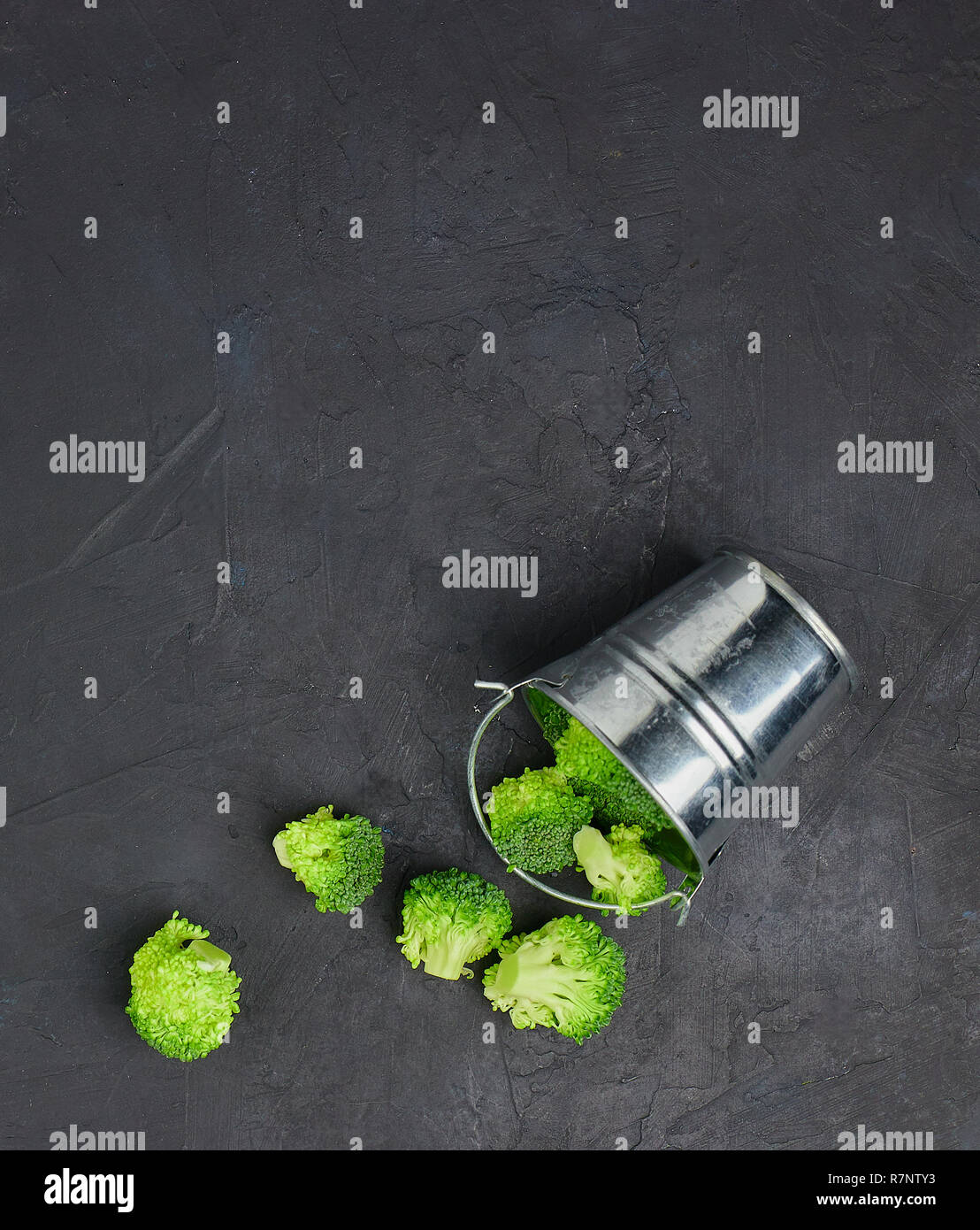 placer green broccoli segments from a small bucket. Healthy eating ...