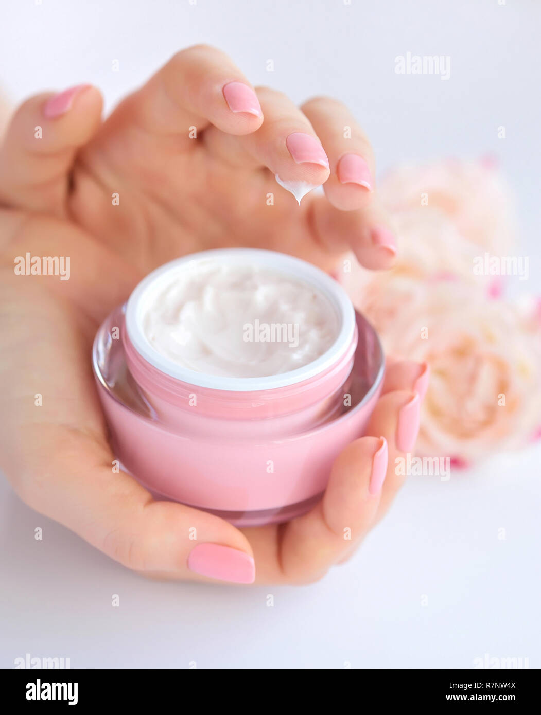 Beautiful woman hands with cream Stock Photo - Alamy