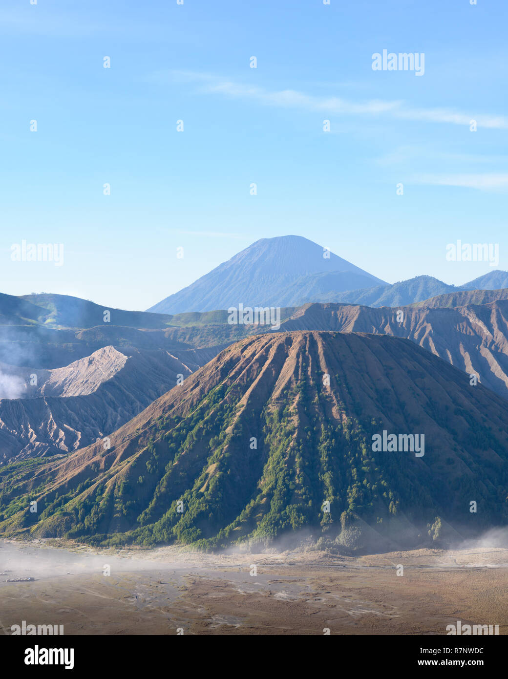 Mount Bromo volcano crater erupts in the caldera, behind Gunung Batok ...