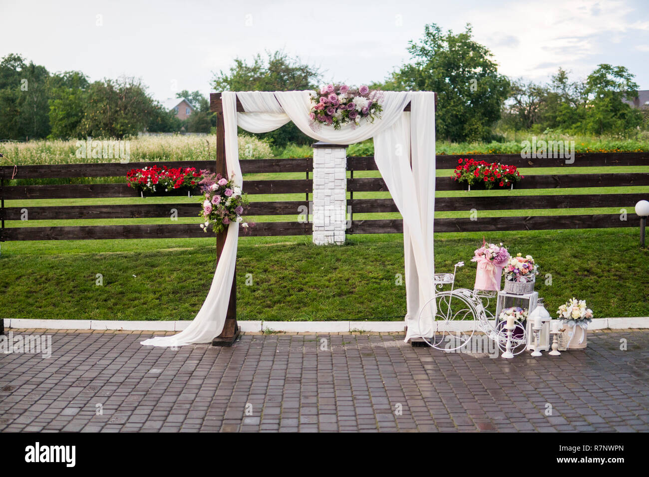 Wedding arch for wedding ceremony. Beautiful wedding decor in rustic ...
