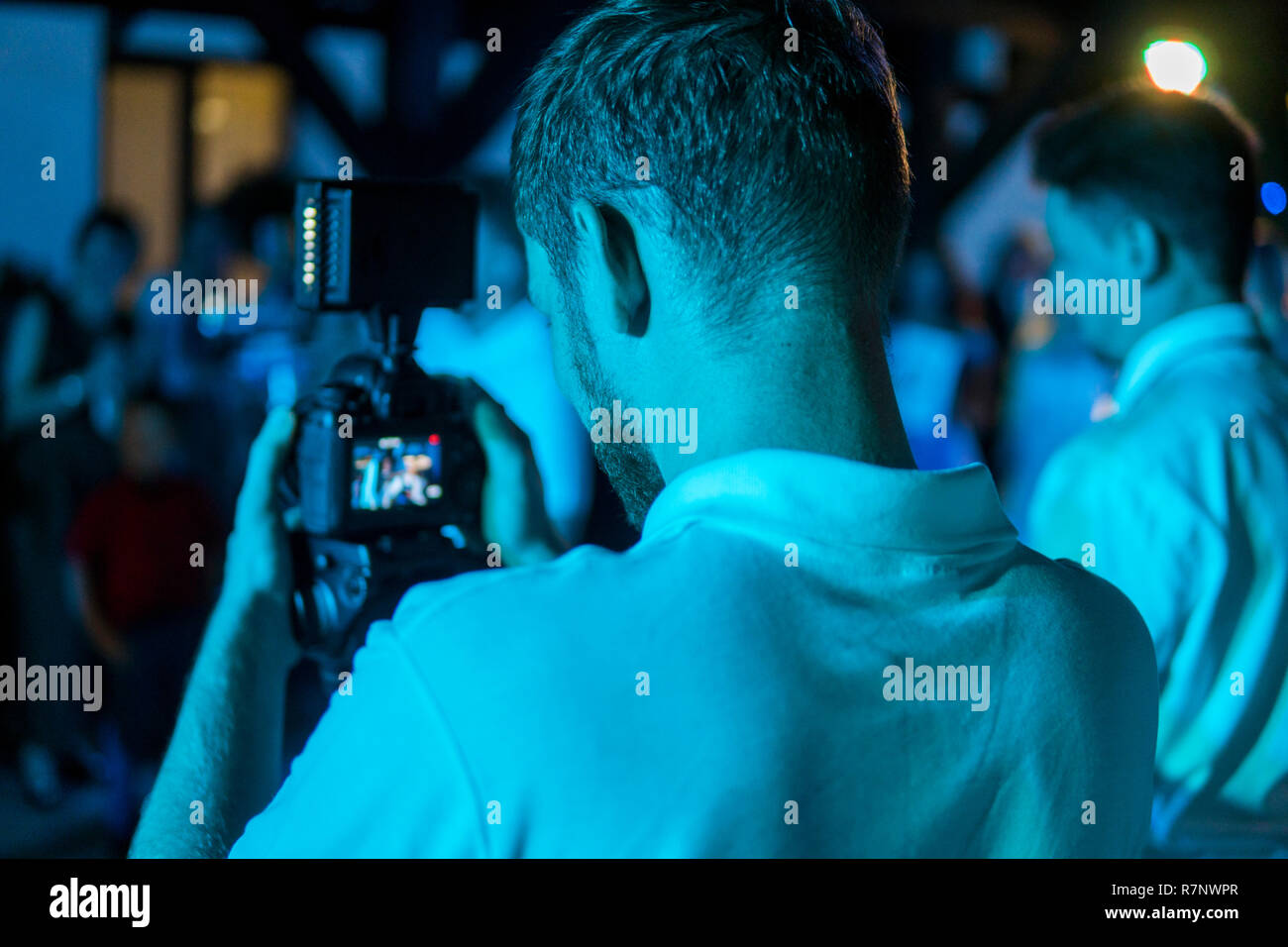 Back of photographer at media event hi-res stock photography and images ...