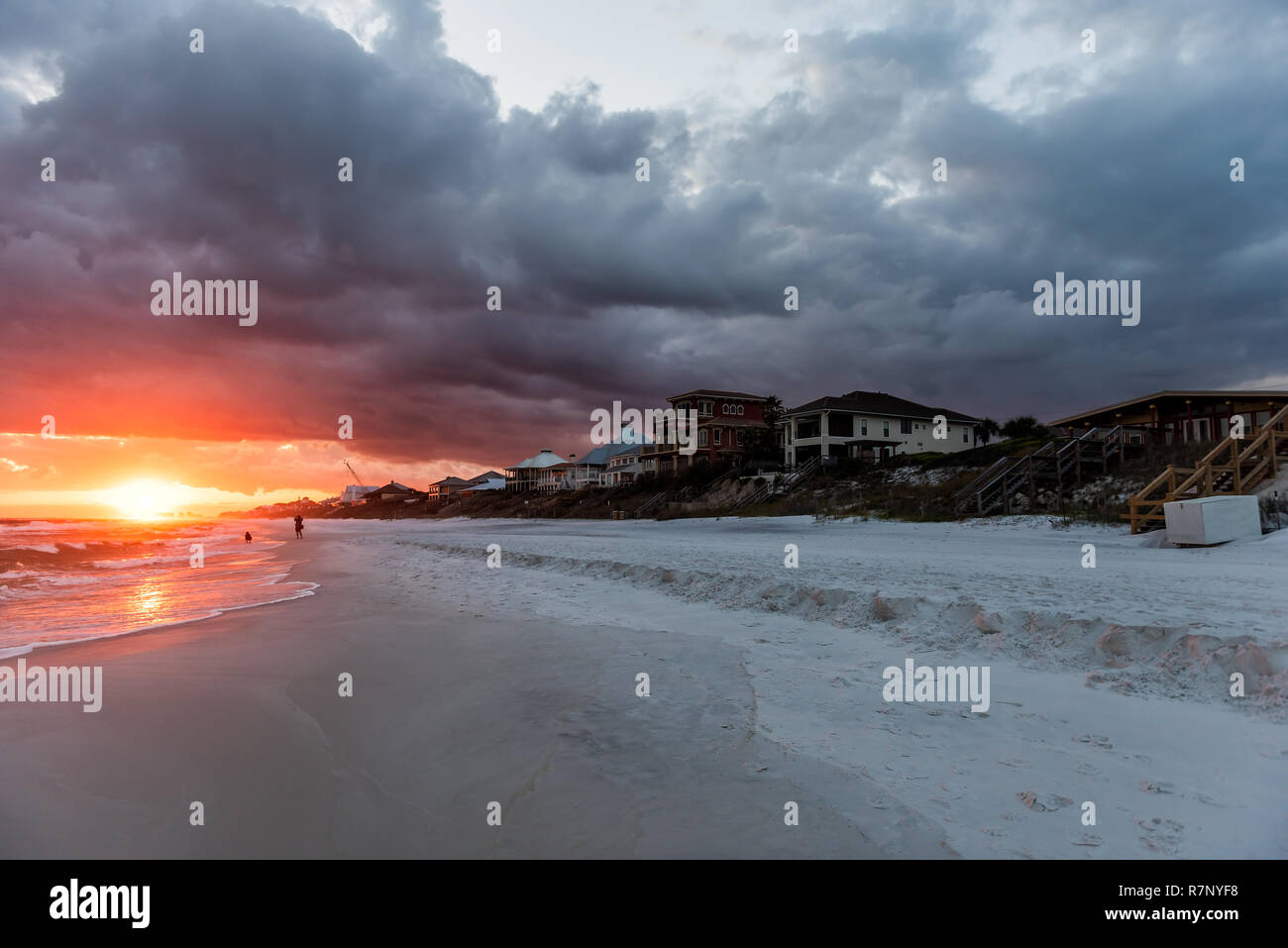 Dramatic red sunset in Santa Rosa Beach, Florida with houses coastline ...