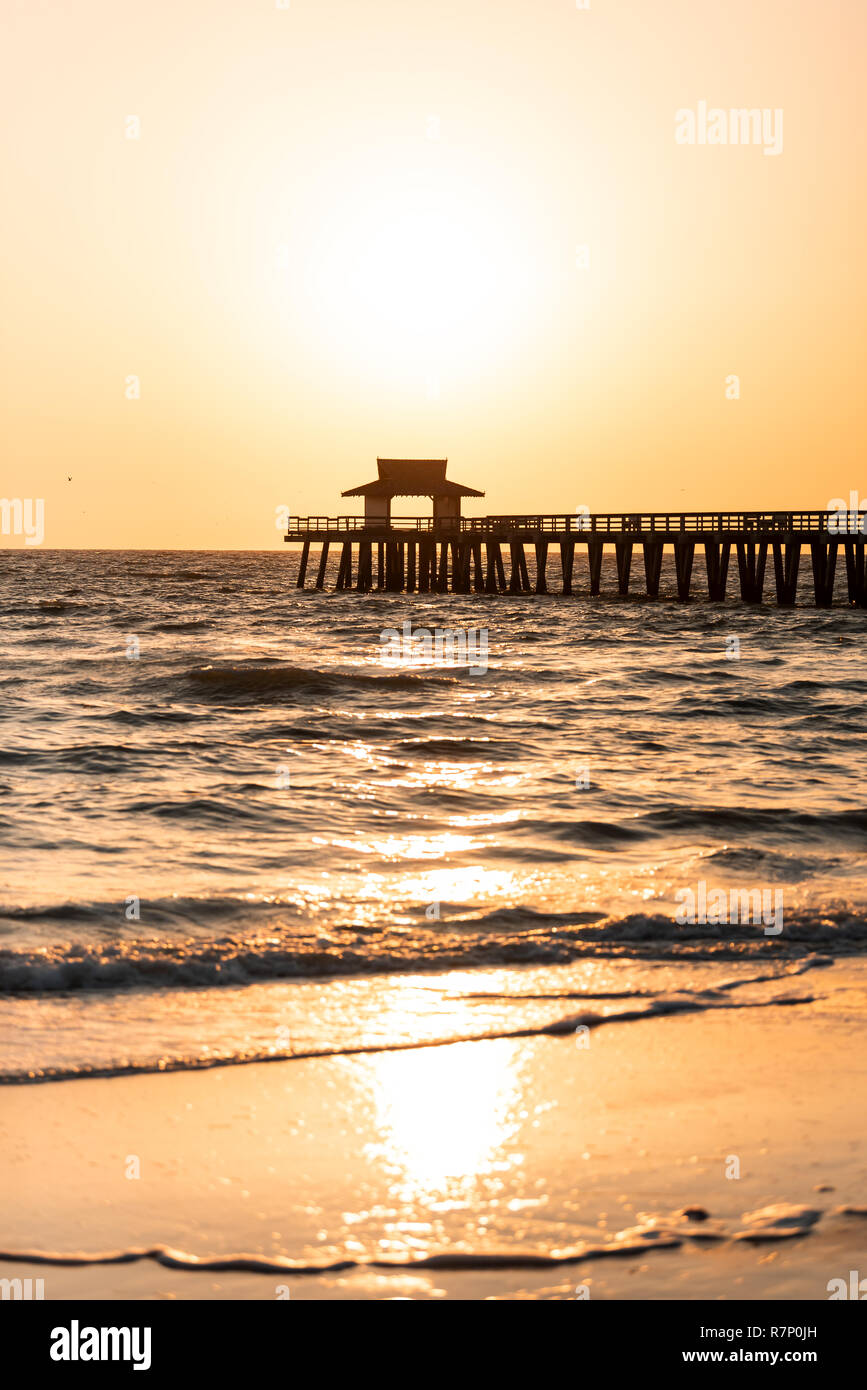 Naples, Florida yellow and orange sunset in gulf of Mexico with sun ...