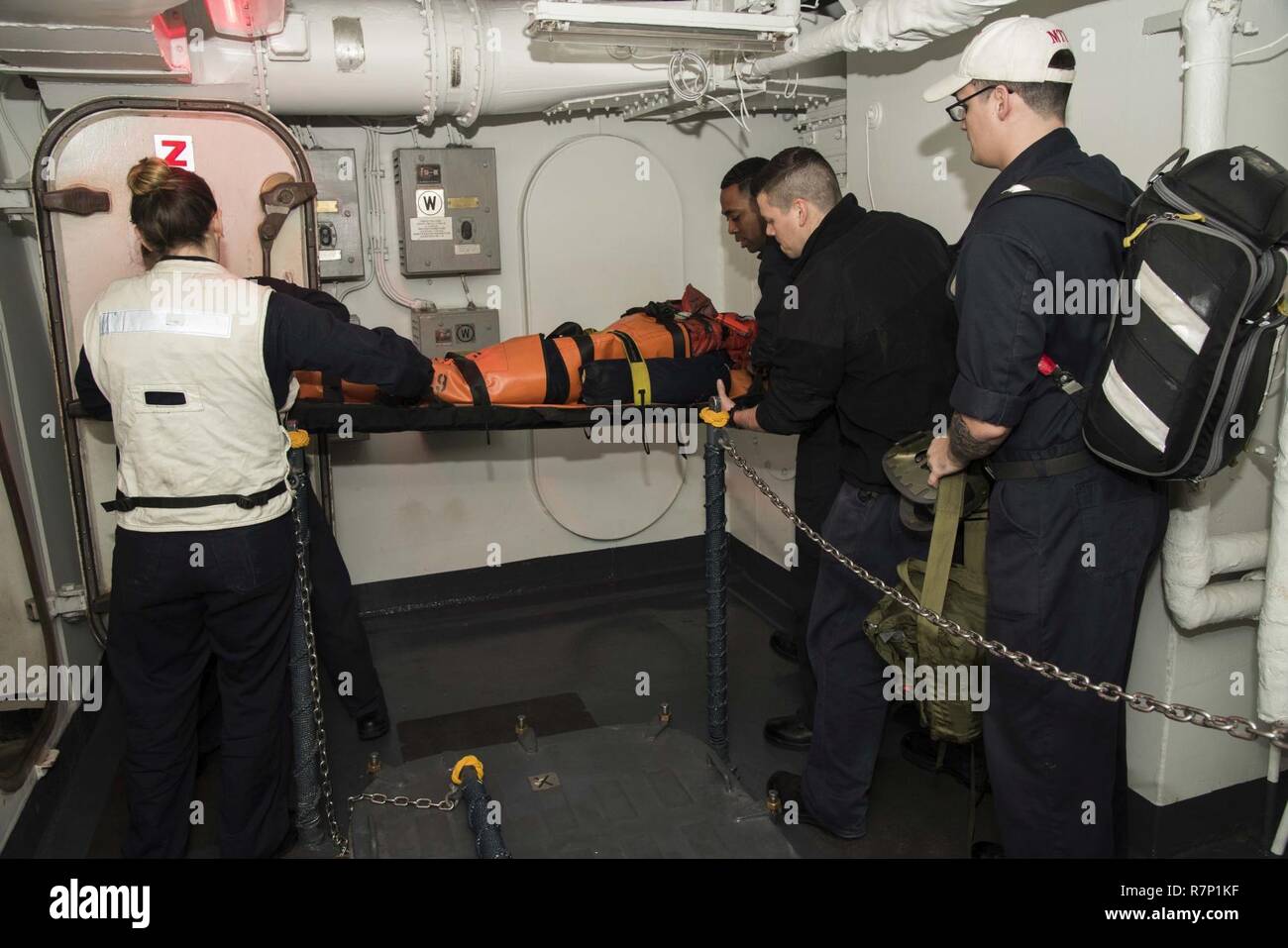 ATLANTIC OCEAN (March 20, 2017) Sailors transport a training dummy on a ...