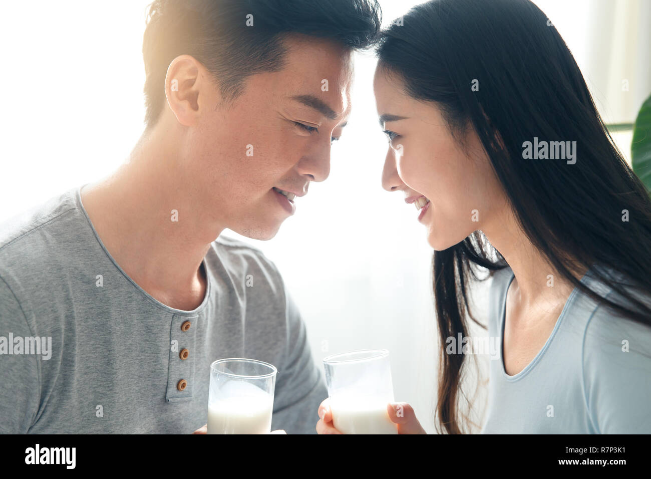 Young couples to drink milk Stock Photo - Alamy
