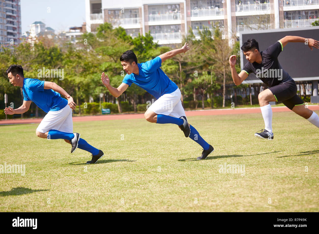 group of young asian athletes training in a outdoor facility Stock ...