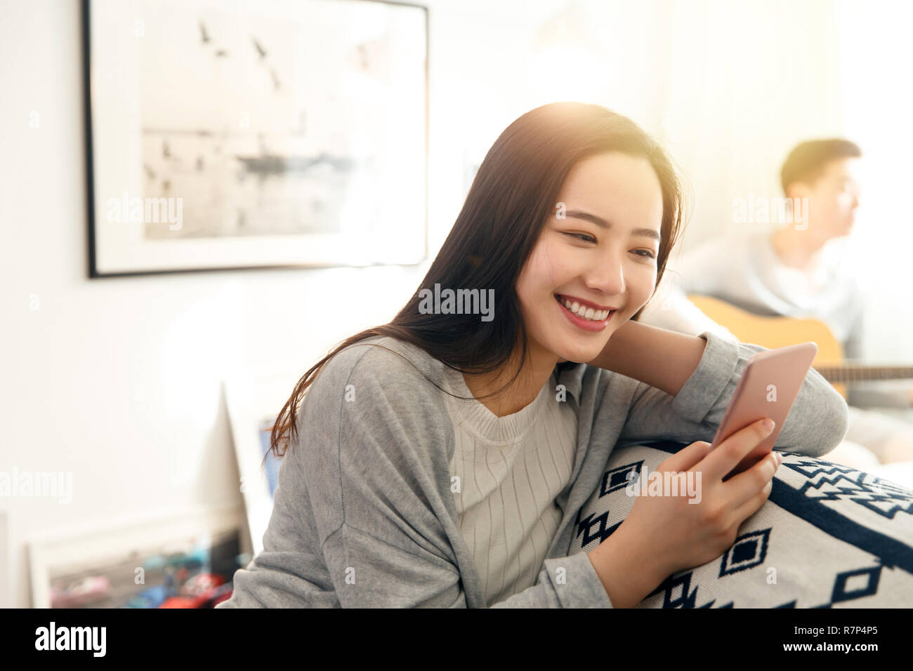 Young women see a mobile phone Stock Photo - Alamy