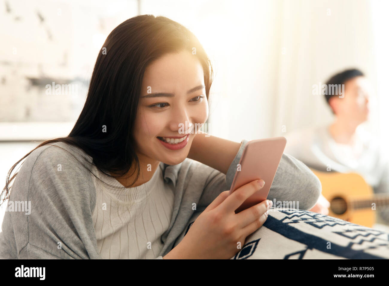 Young women see a mobile phone Stock Photo - Alamy