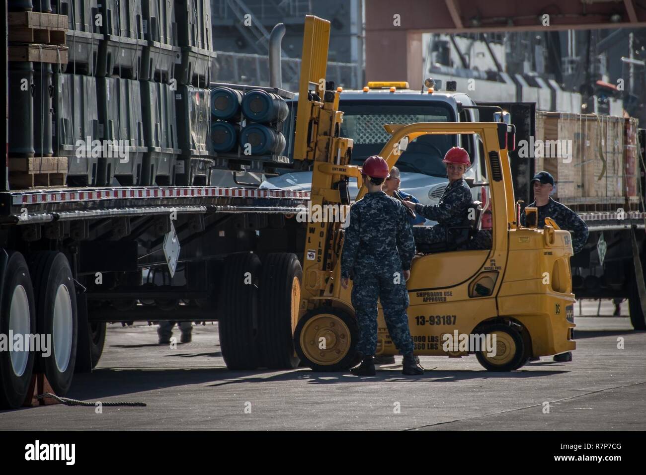 SAN DIEGO (Mar. 28, 2017) A Sailors use a forklift to transport ...