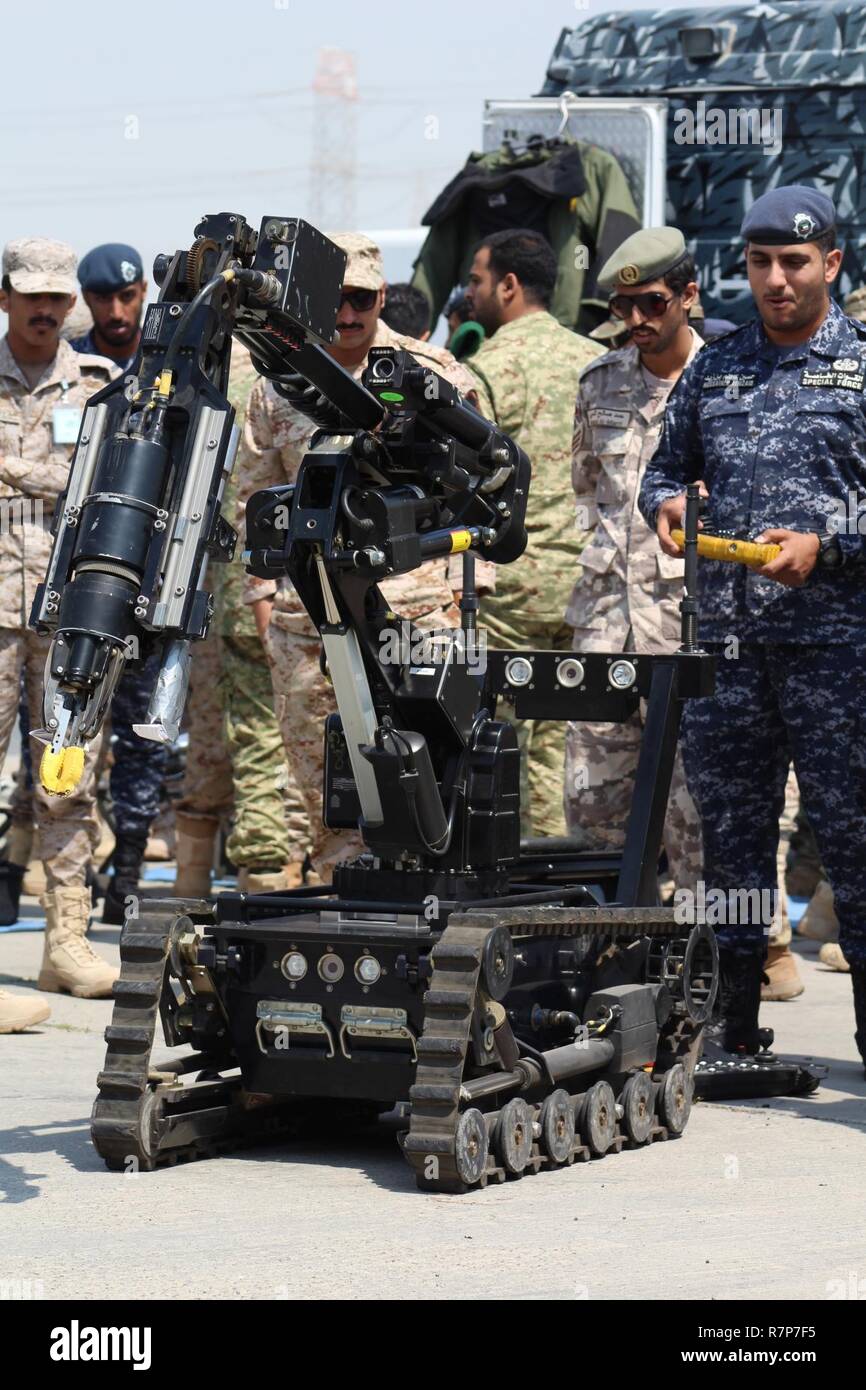 An explosive ordnance disposal specialist with the Kuwait Ministry of ...