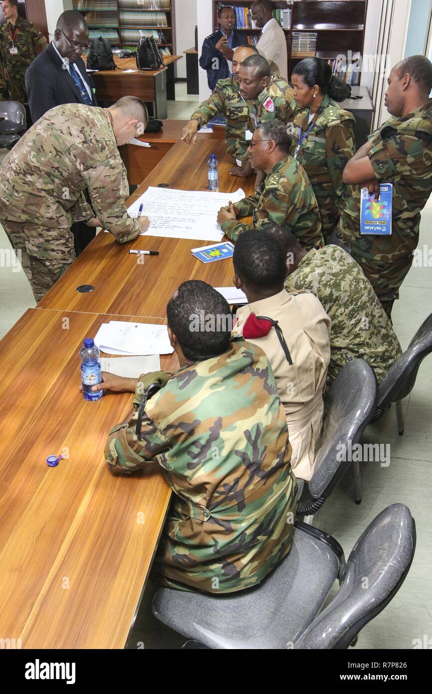 Capt. Matthew Ford, an operations planner with Combined Joint Task Force-Horn of Africa, and ...