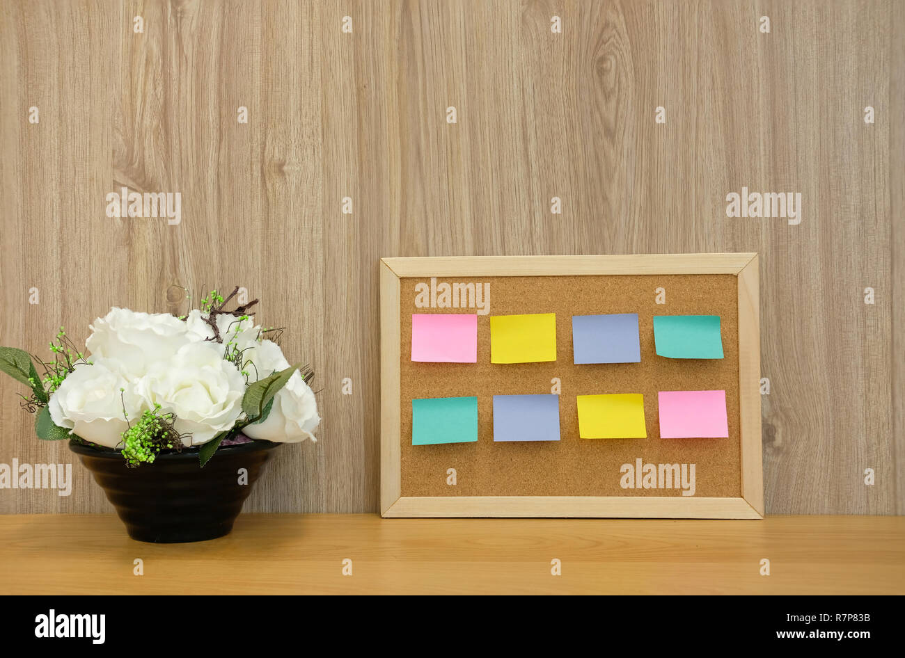 sticky notes paper reminder on cork board on wooden desk. bulletin ...