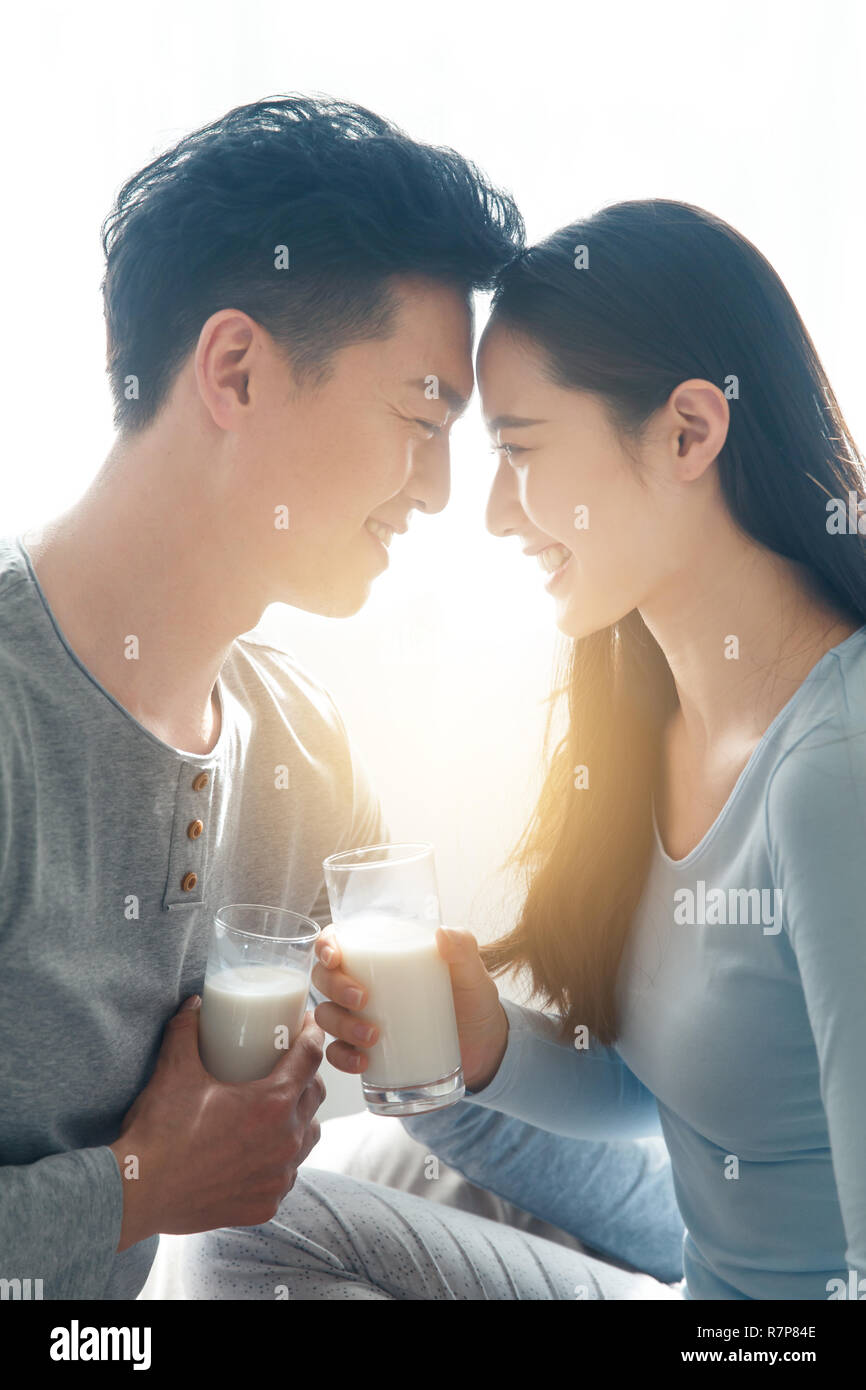 Young couples to drink milk Stock Photo - Alamy