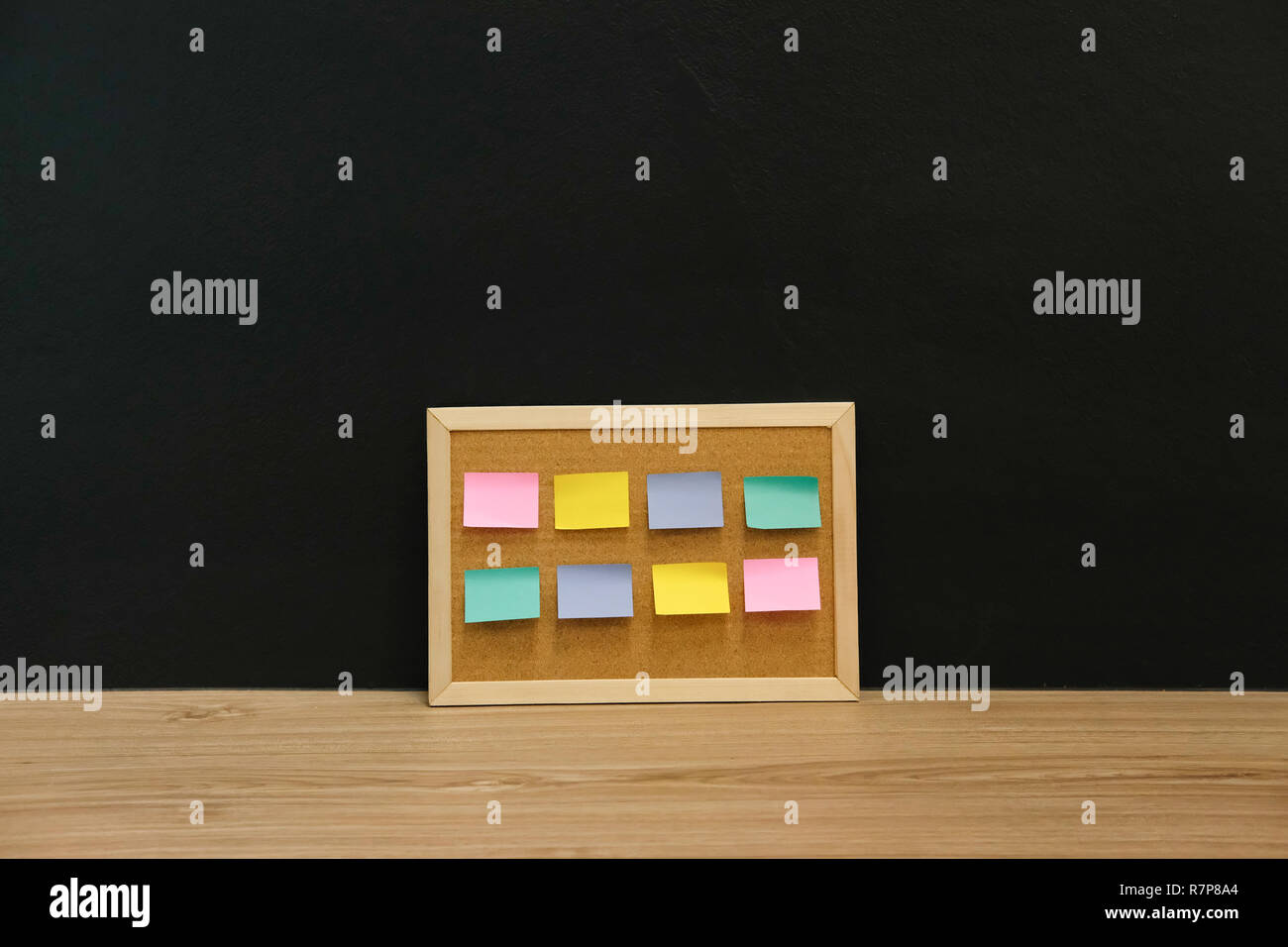 sticky notes paper reminder on cork board on wooden desk. bulletin ...