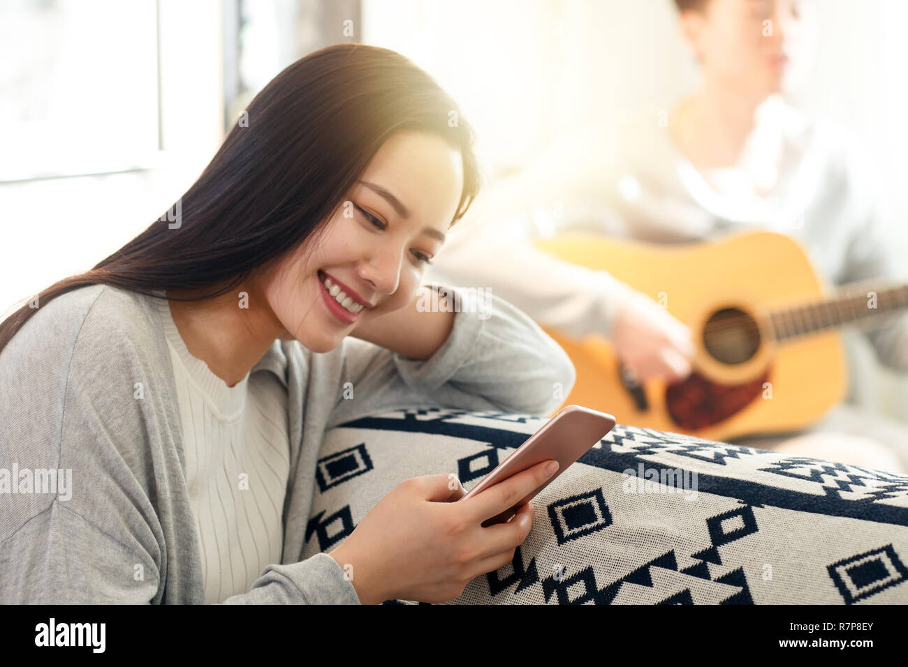Young women see a mobile phone Stock Photo - Alamy