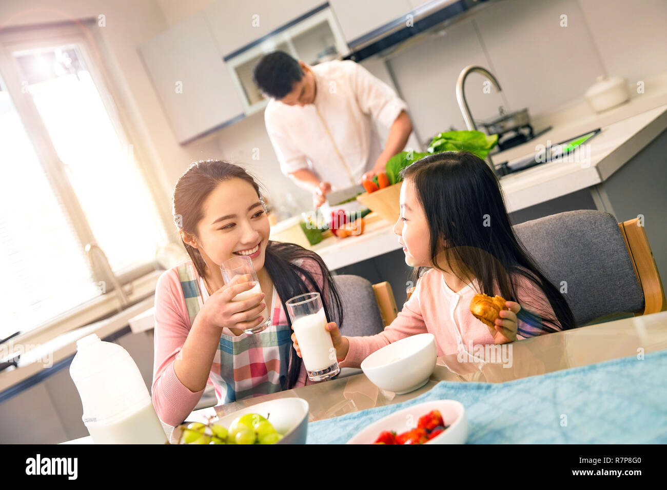 Happy family was eating breakfast Stock Photo - Alamy