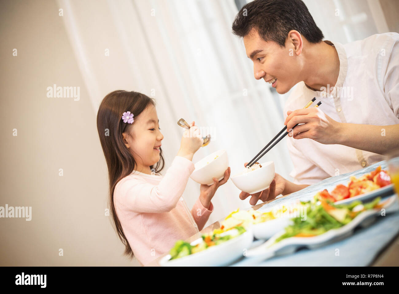 Father and daughter at dinner Stock Photo - Alamy