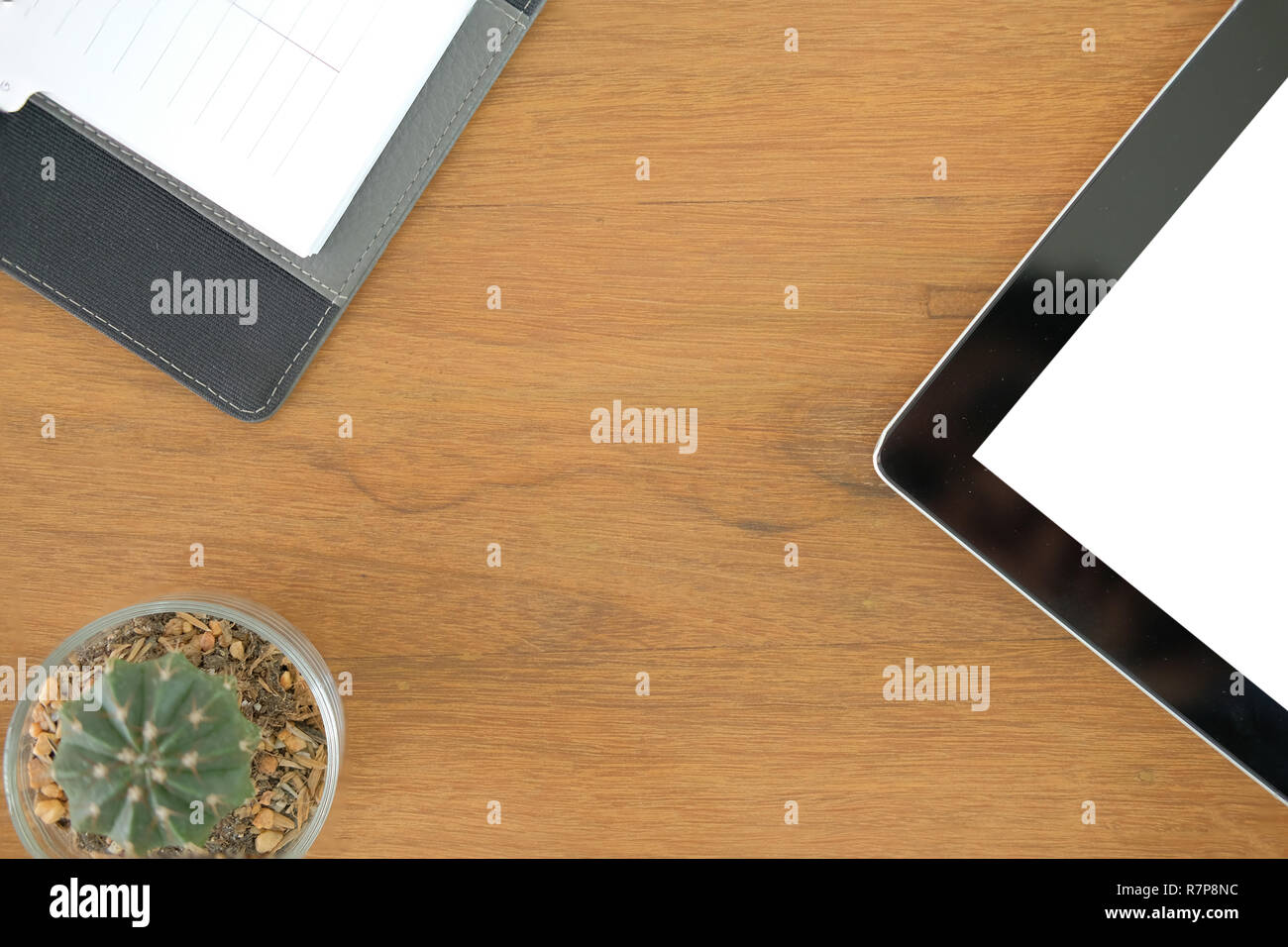 tablet notebook on wooden desk table. office workplace workspace top ...