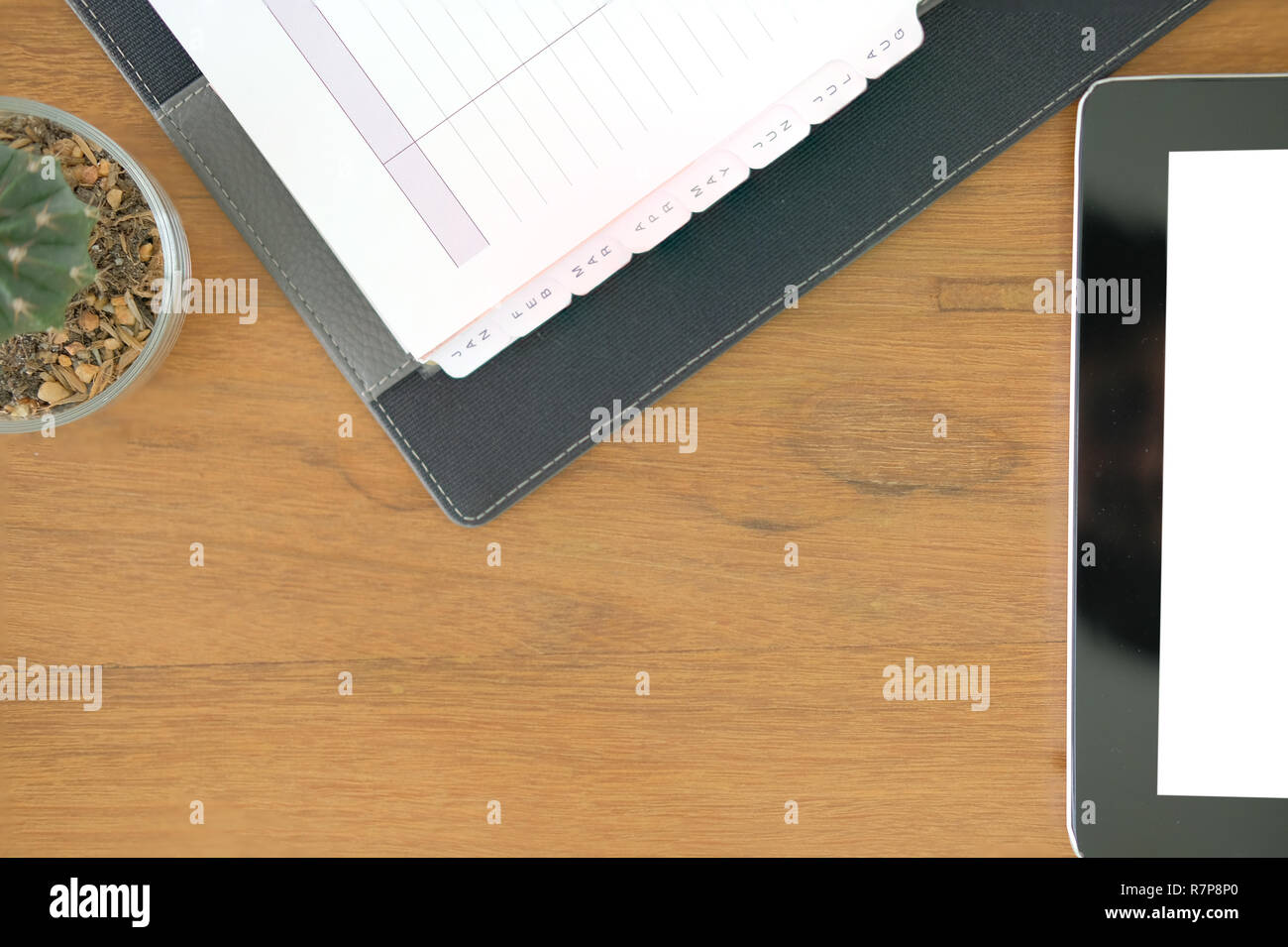 tablet notebook on wooden desk table. office workplace workspace top ...