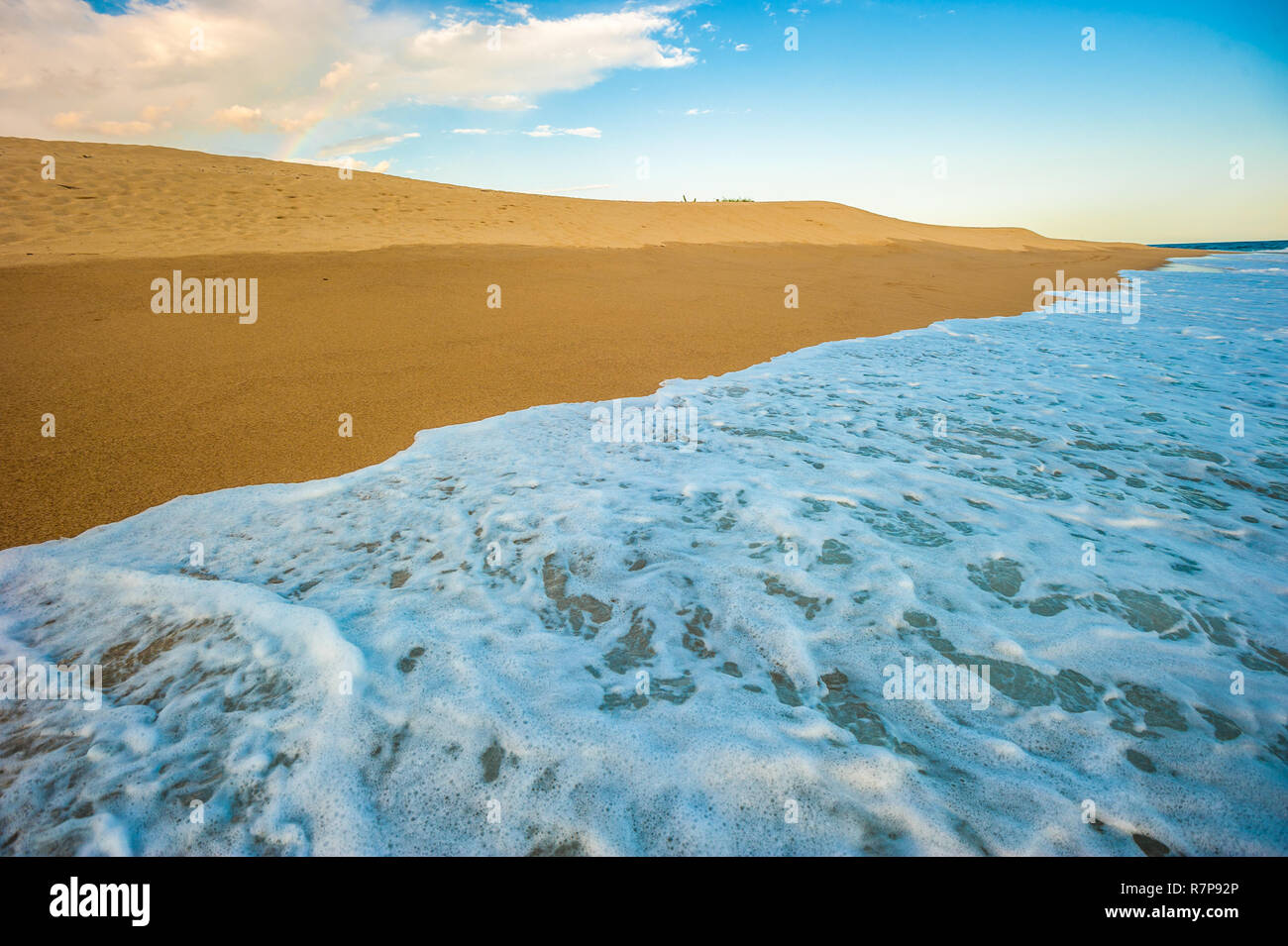 Yellow sand beach, sea and deep blue sky Stock Photo - Alamy