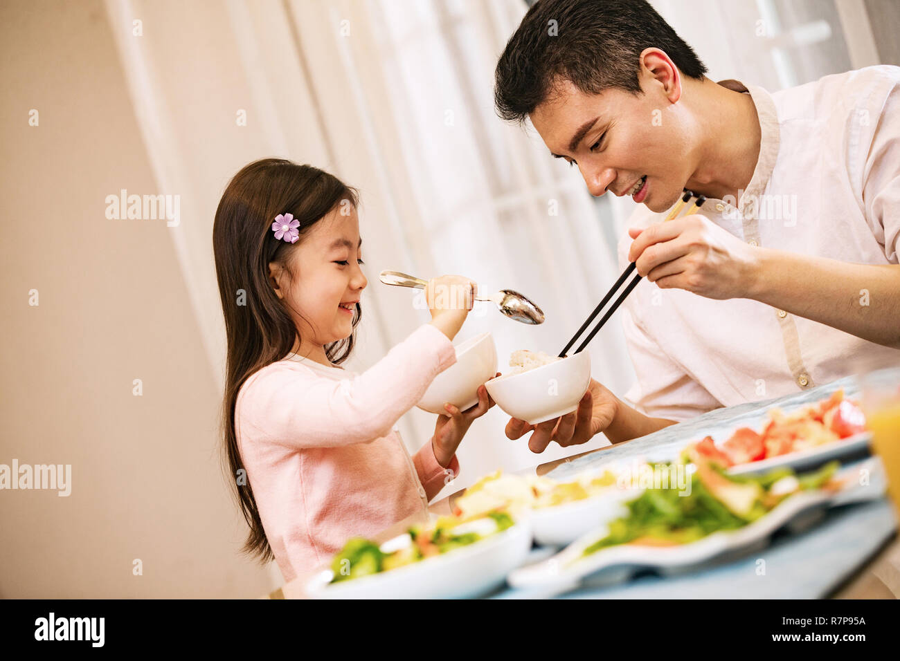 Father and daughter at dinner Stock Photo - Alamy
