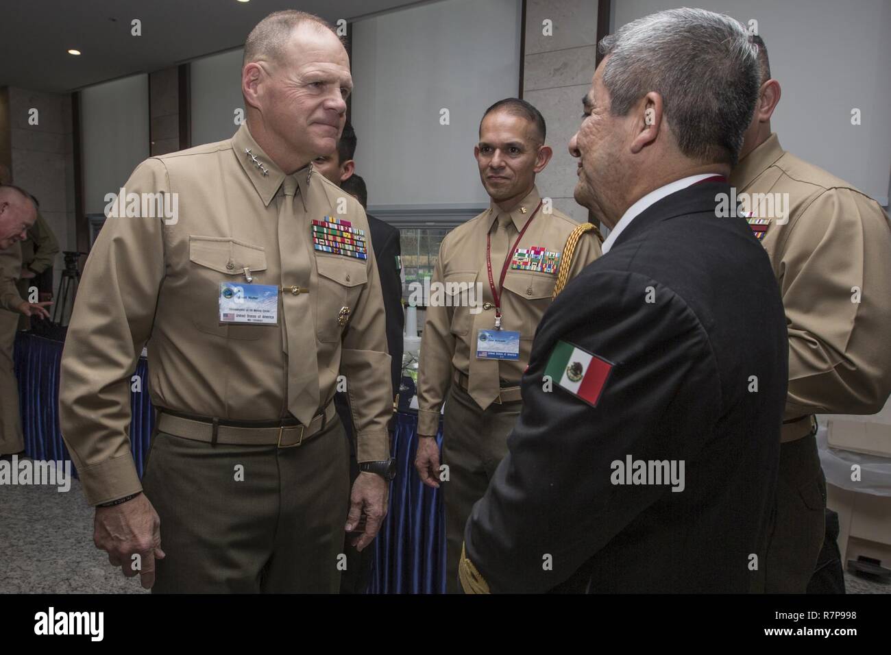 Commandant of the Marine Corps Gen. Robert B. Neller, left, speaks with ...