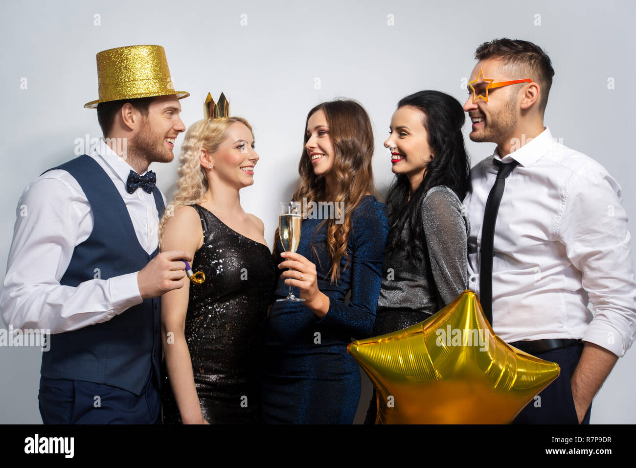 happy friends with golden party props posing Stock Photo - Alamy