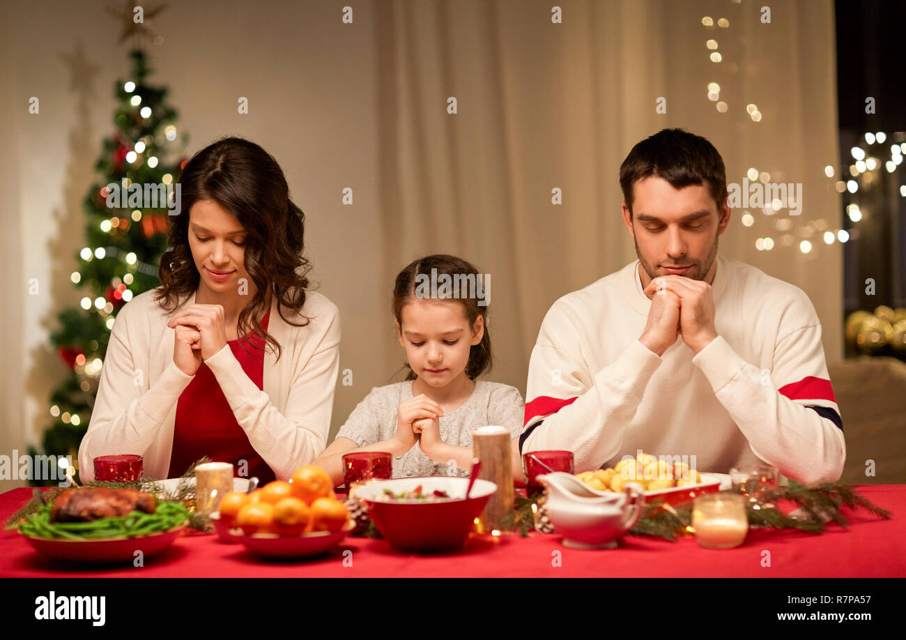 Family praying together hi-res stock photography and images - Alamy