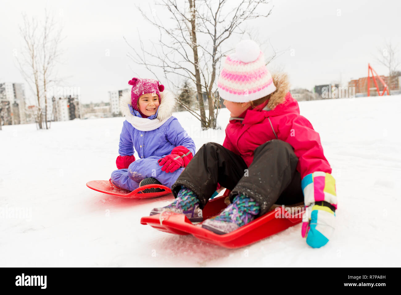 Girls With Sleds High Resolution Stock Photography and Images - Alamy