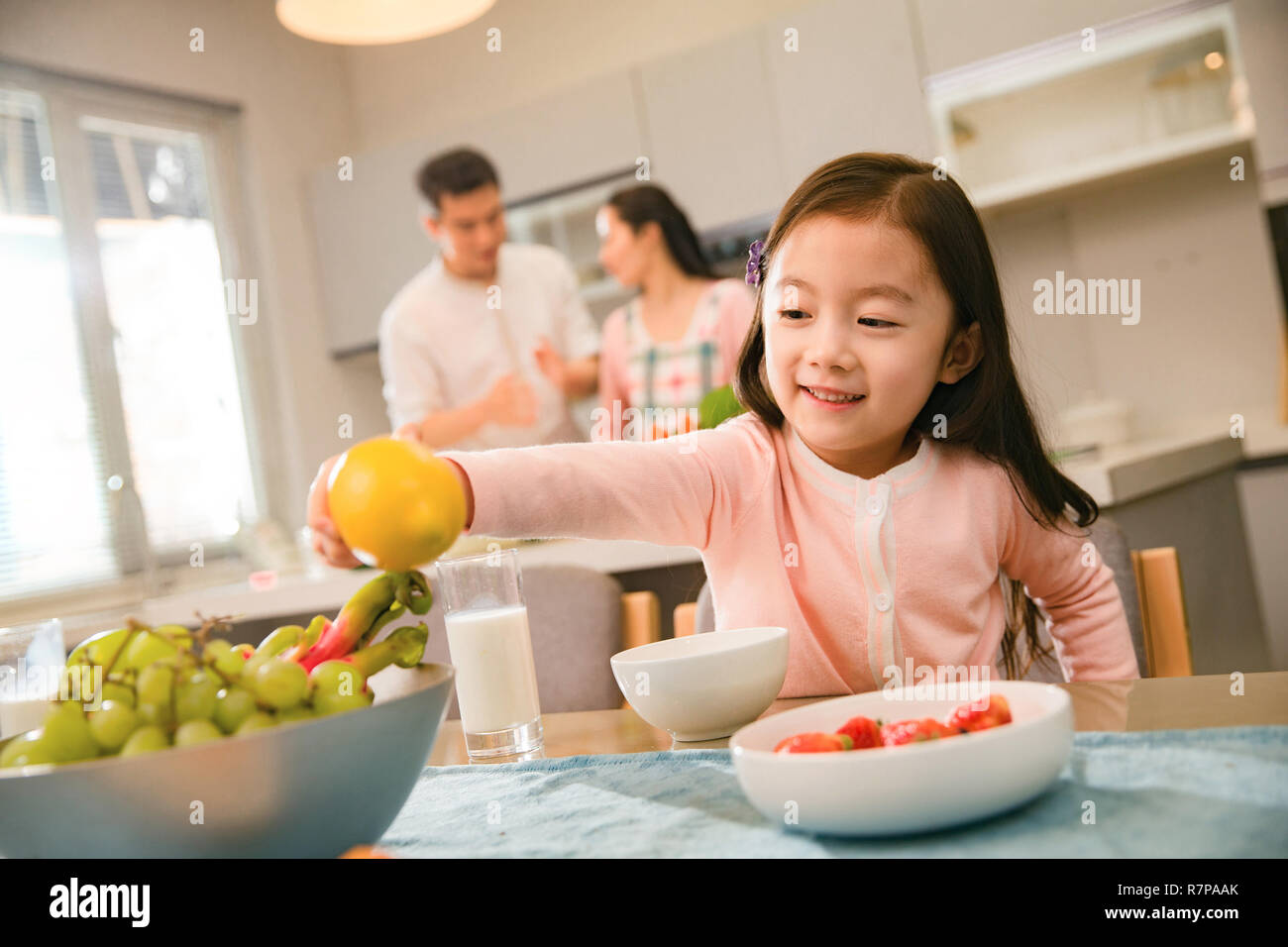 Happy family was eating breakfast Stock Photo - Alamy