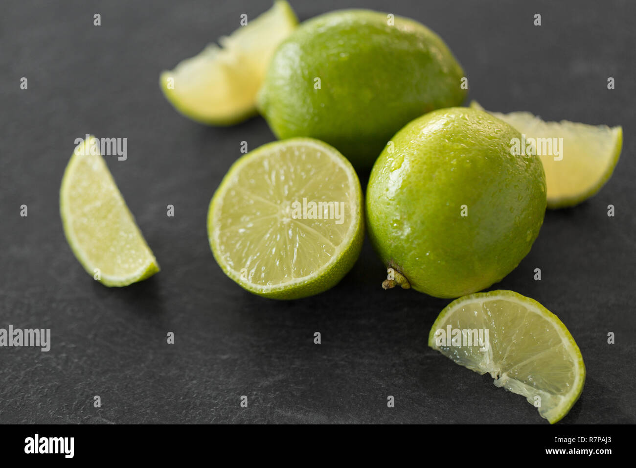 close up of limes on slate table top Stock Photo - Alamy