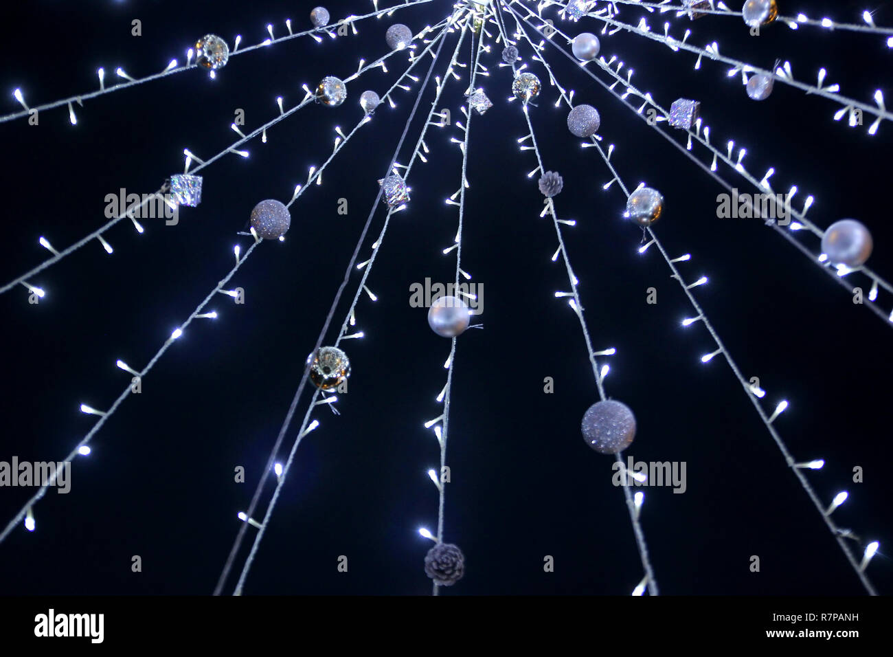 christmas tree decorated by lights at night Stock Photo - Alamy