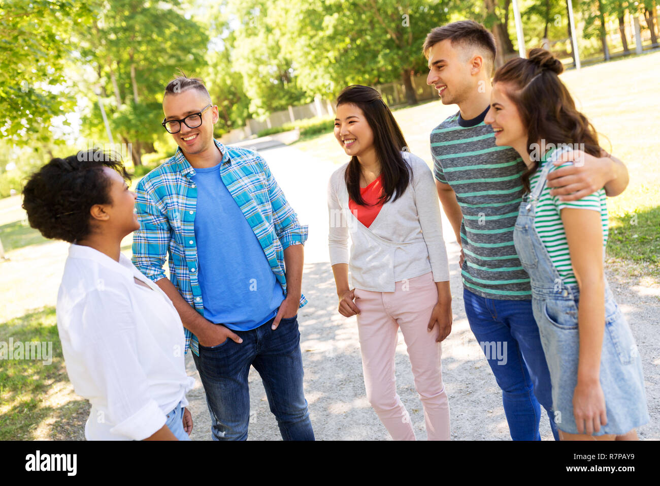 Happy international friends talking hi-res stock photography and images ...